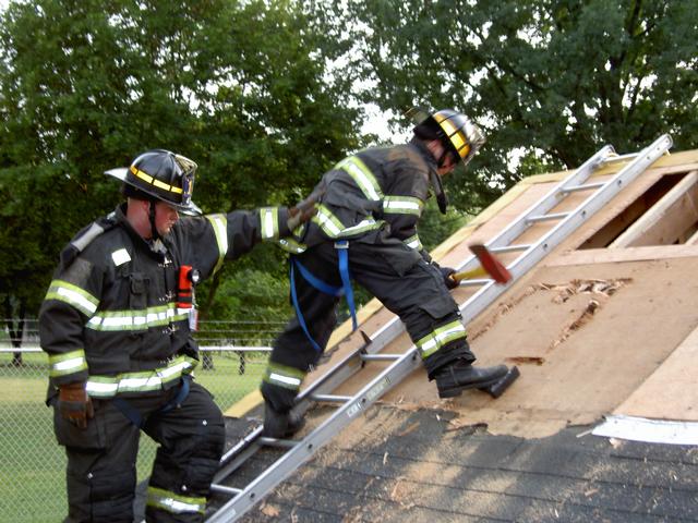 Firefighter On Roof